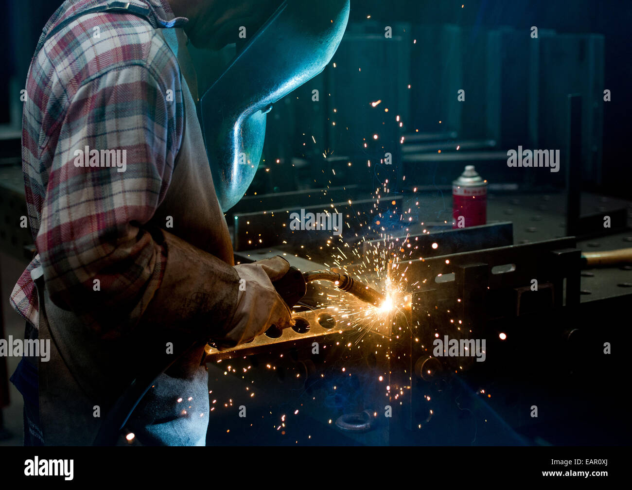 A ThyssenKrupp Elevator Factory employee welds in Neuhausen auf den ...