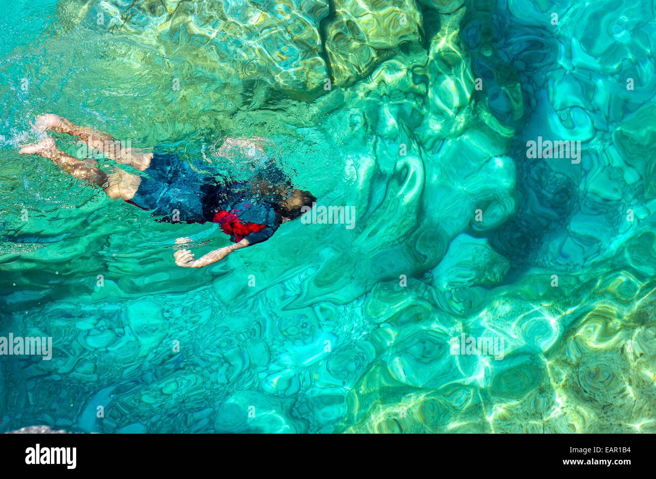 Blue swimming suit hi-res stock photography and images - Alamy
