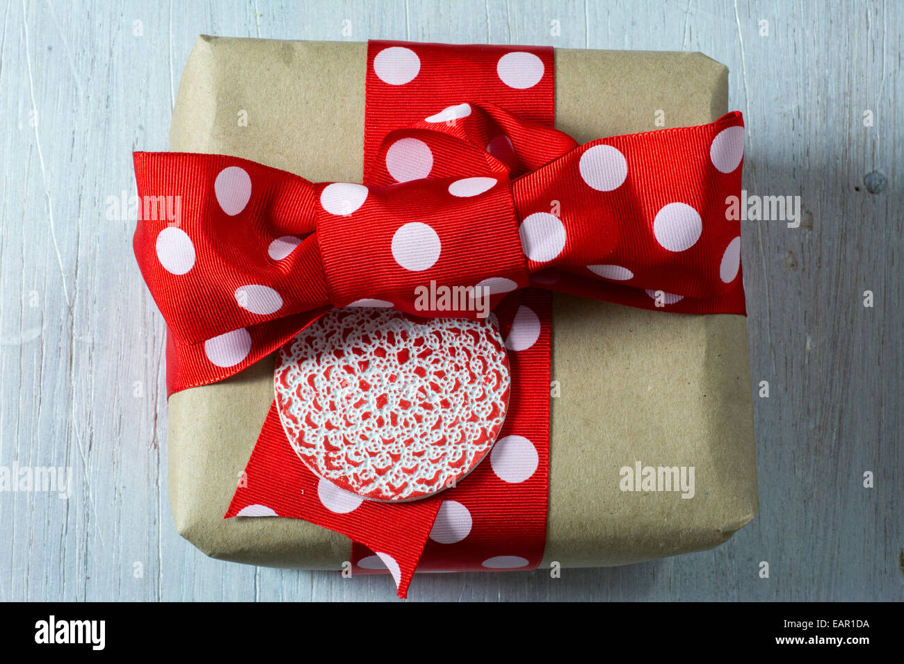 gift box handmade dotted red tape and label, wrapped in brown paper ...