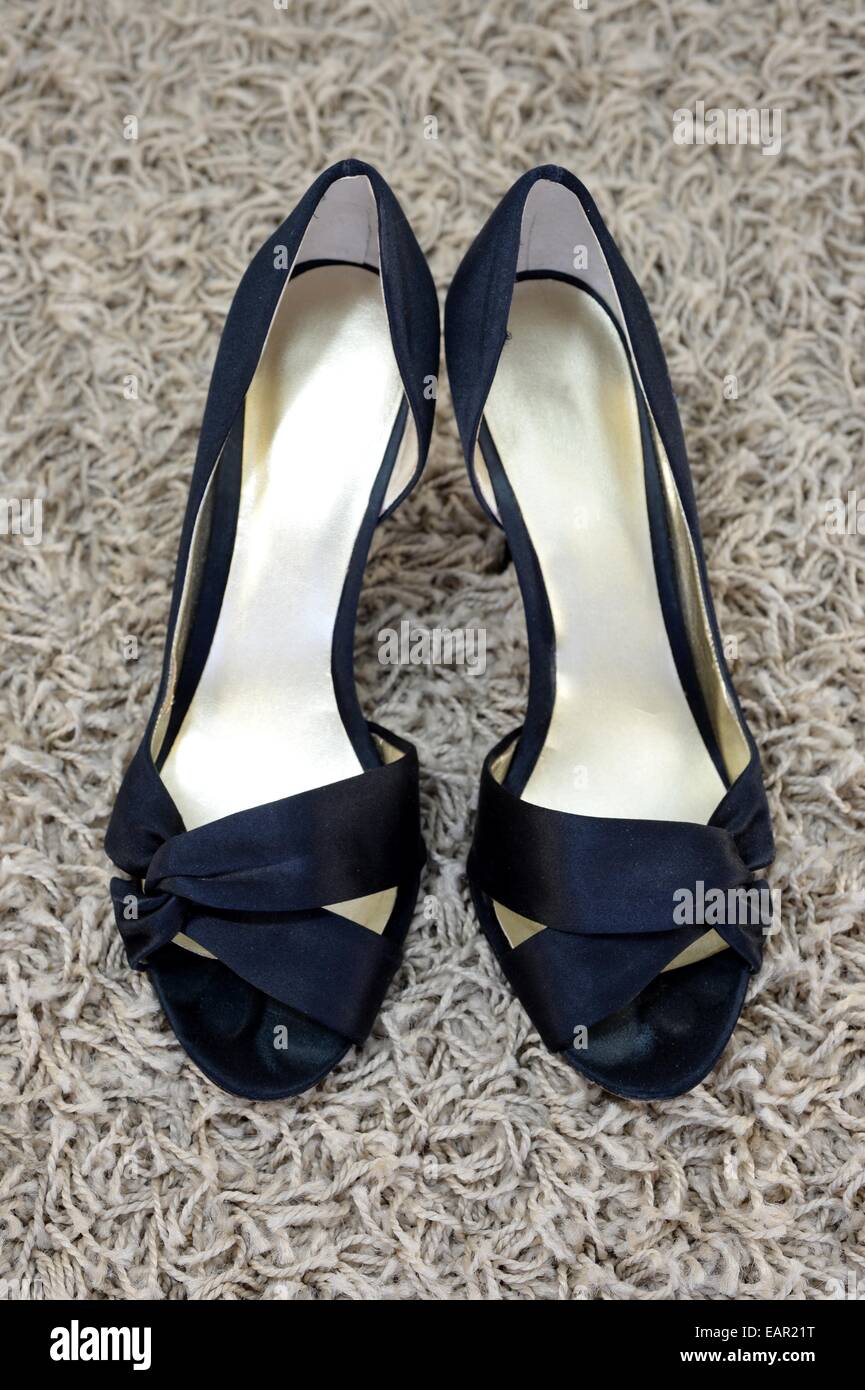 A close up shot of shoes on carpet Stock Photo - Alamy