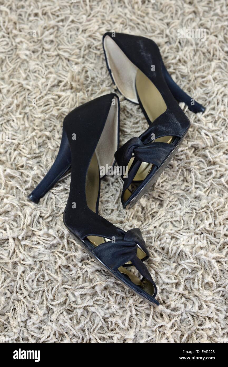 A close up shot of shoes on carpet Stock Photo - Alamy