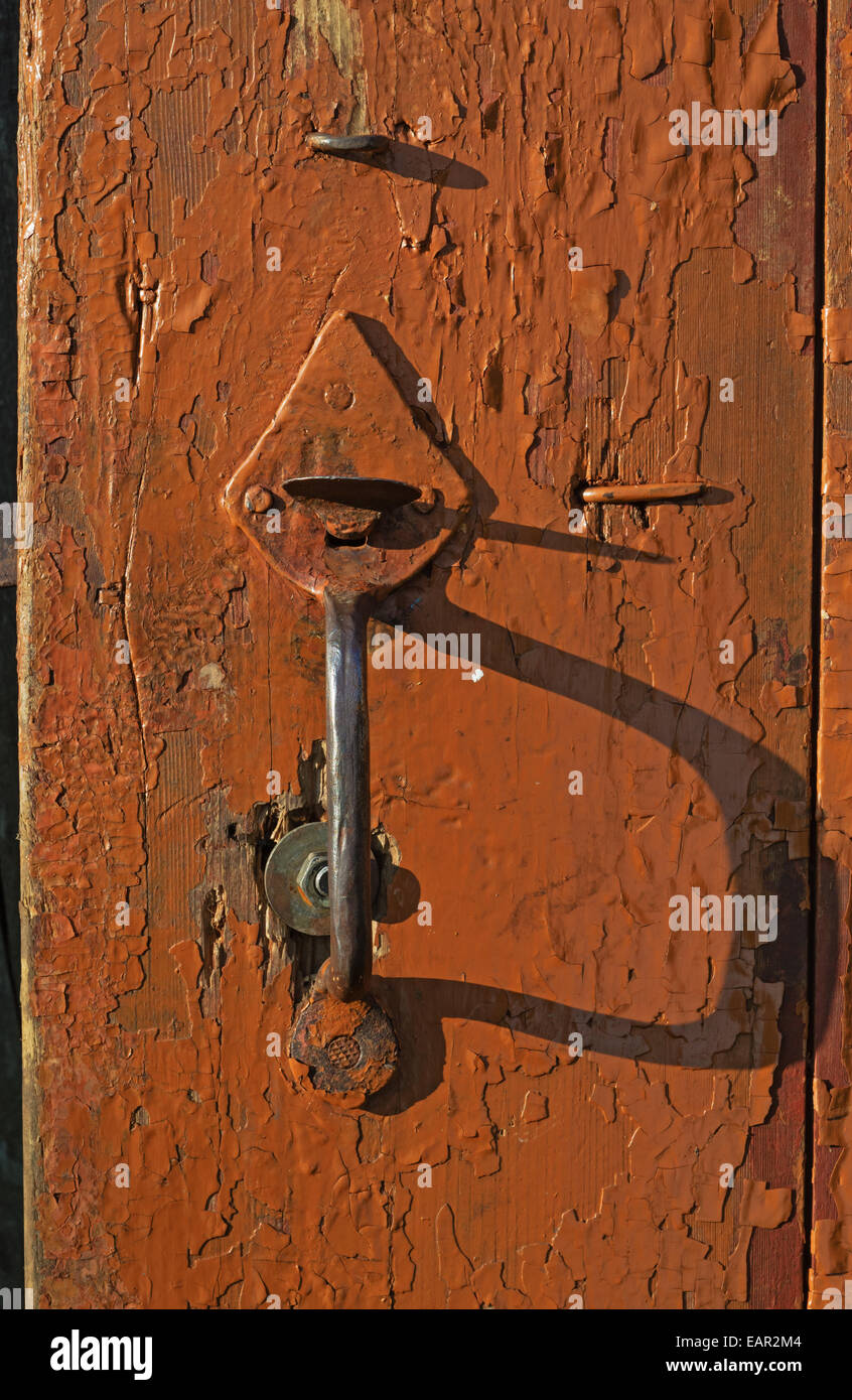 Disassembled details from old wooden house. Inner brown door - lock ...
