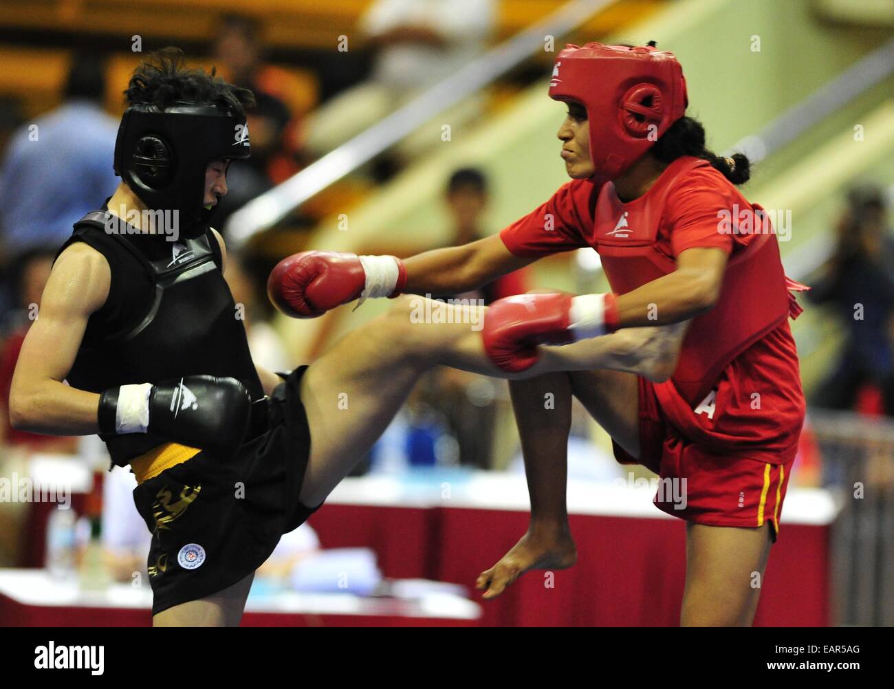 Jakarta, Indonesia. 20th Nov, 2014. Wang Cong (L) of China competes ...