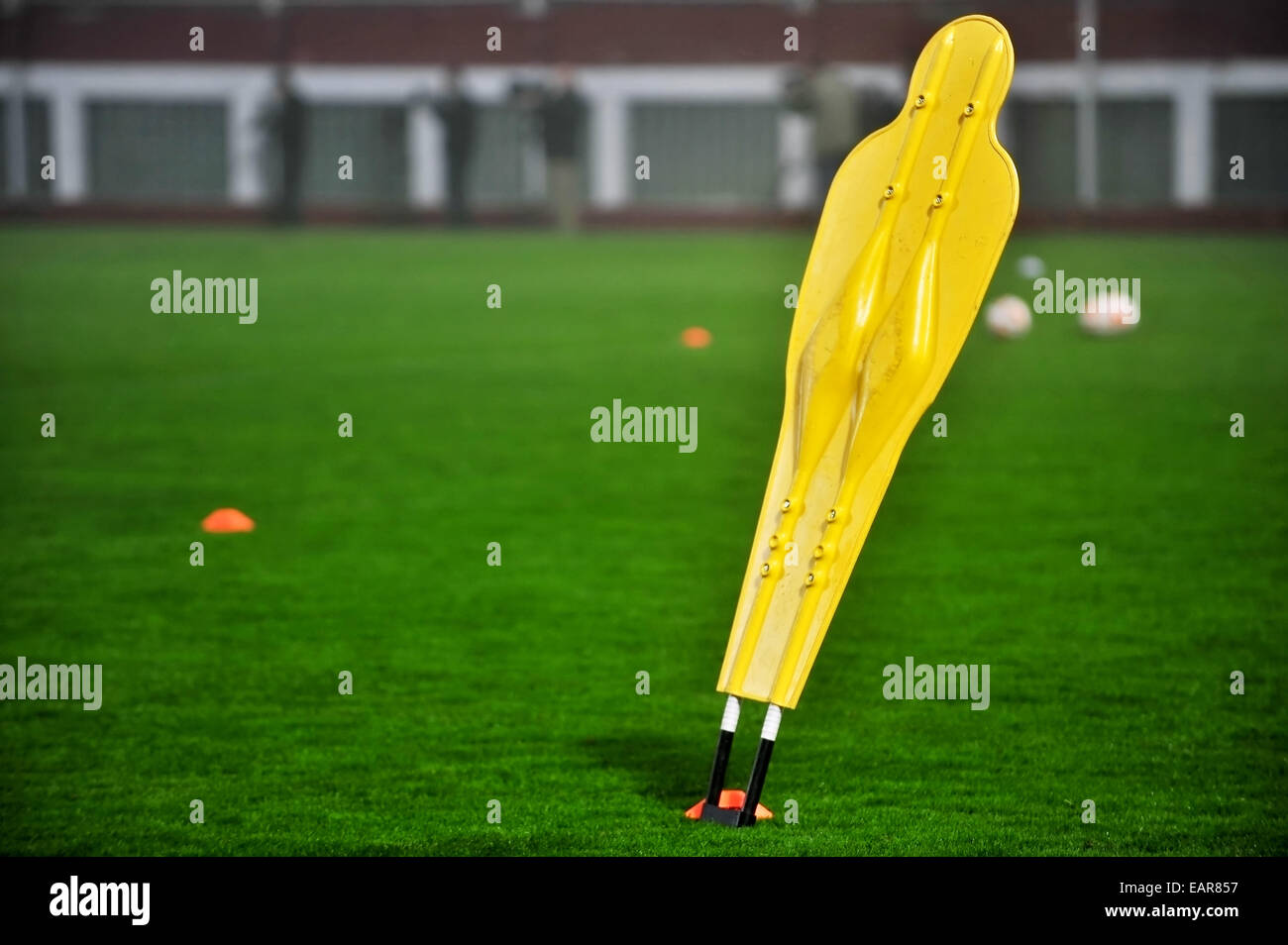 One yellow soccer training dummy on the field Stock Photo - Alamy