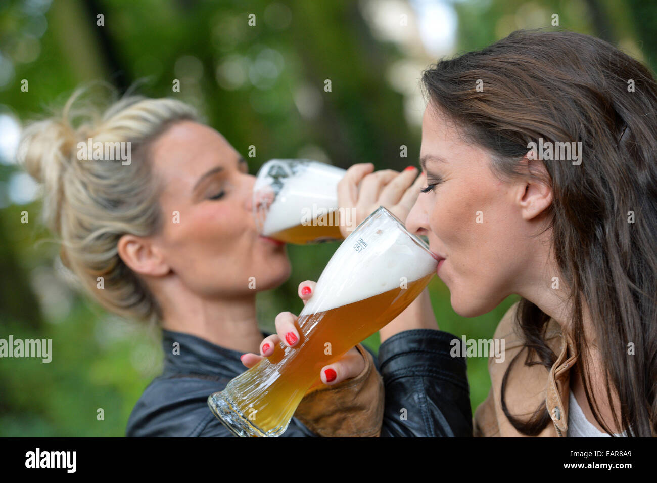Two women having a weiss beer Stock Photo - Alamy
