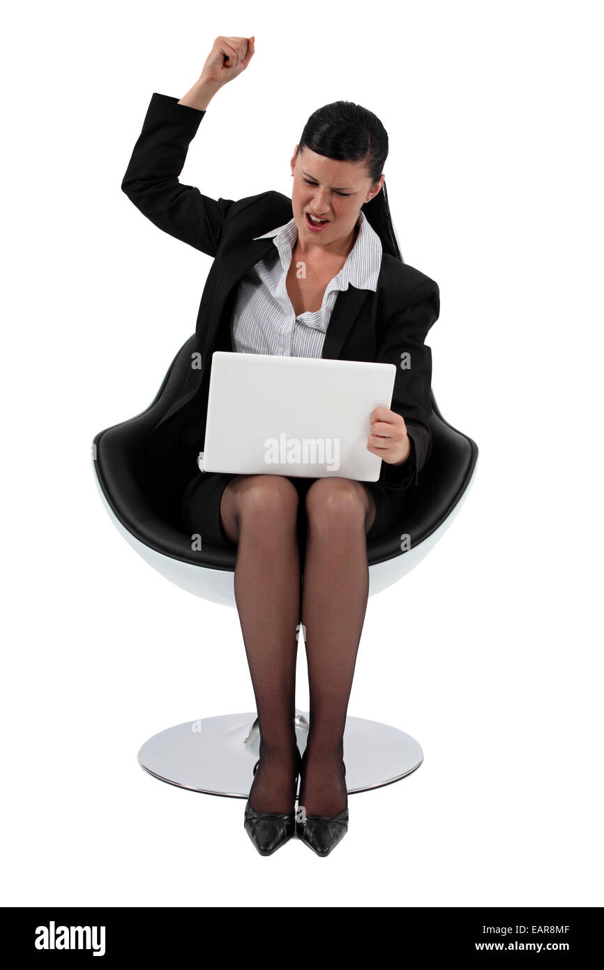 Excited businesswoman pumping fist in the air Stock Photo - Alamy