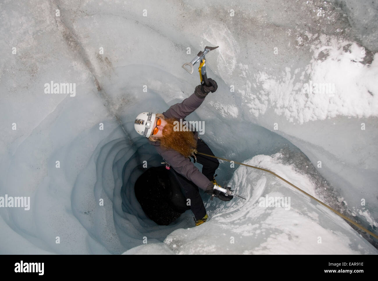 Man climbing out of hole hi-res stock photography and images - Alamy