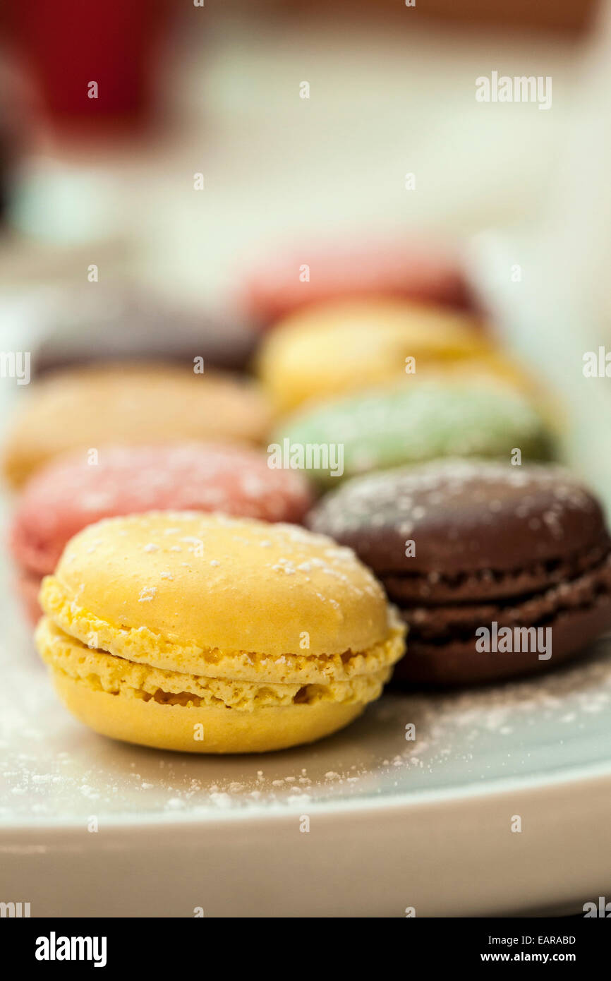 Colourful macaroons on a plate. Modern tapa Stock Photo - Alamy