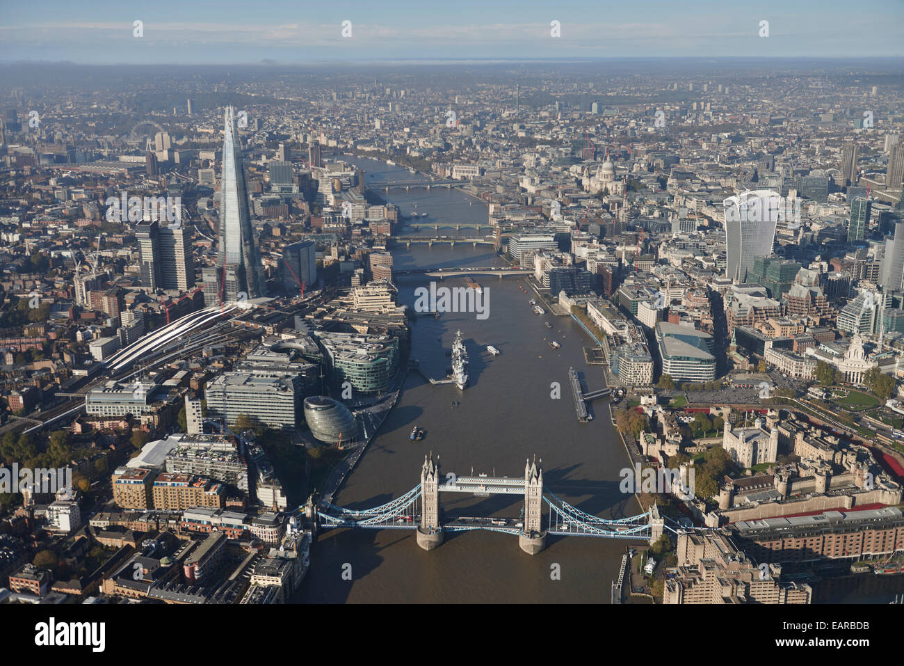An aerial view looking down the River Thames with Tower Bridge in the ...