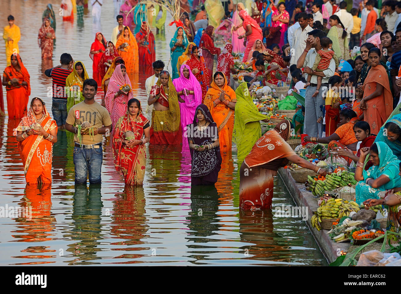 Hindus standing in water during the Hindu Chhath Festival, New Delhi ...