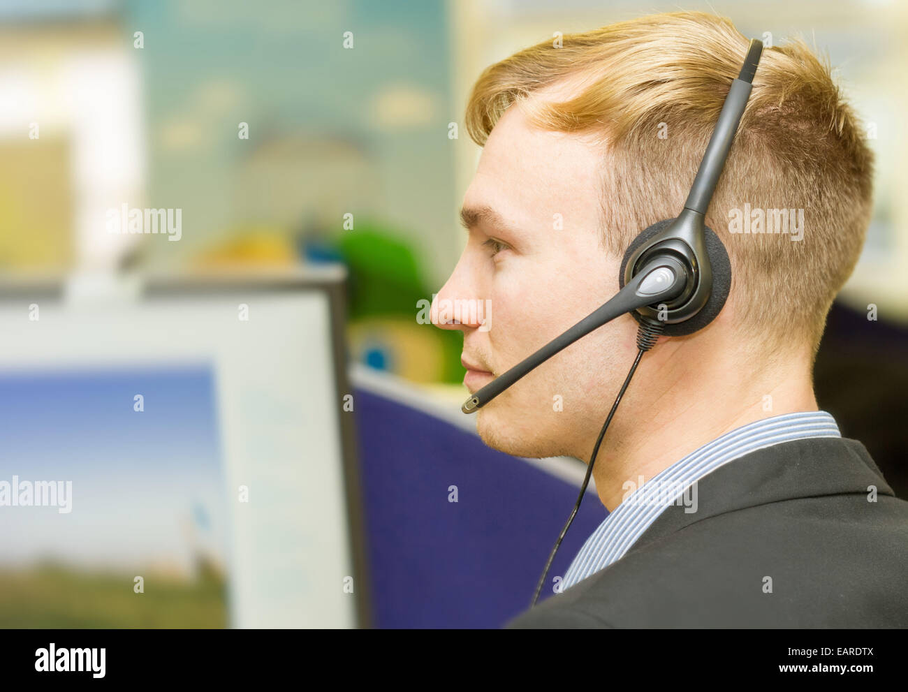 Call Centre staff - young blond man wearing an audio headset Stock ...