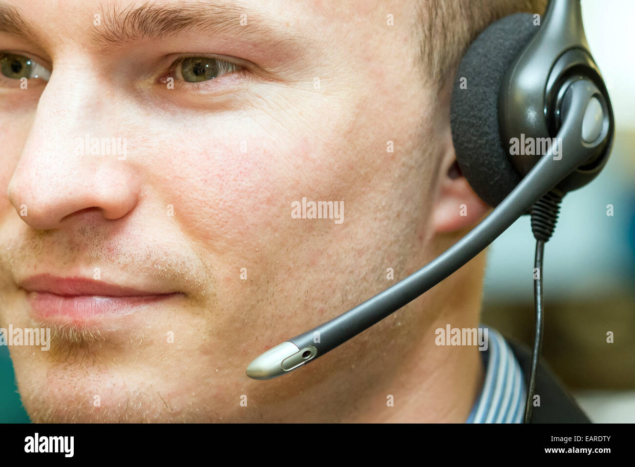 Call Centre staff - young blond man wearing an audio headset Stock ...
