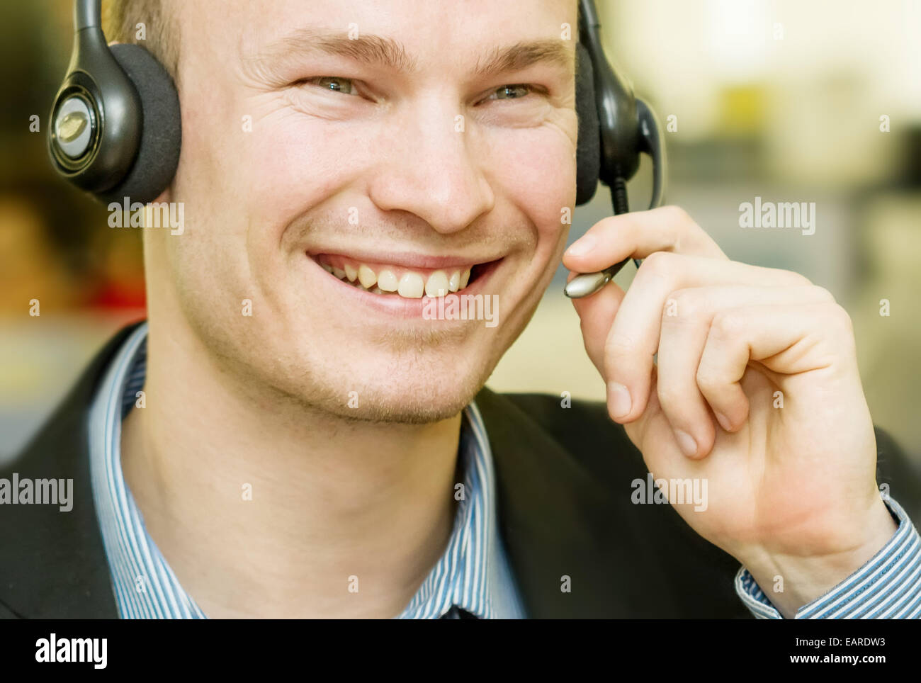 Call Centre staff - young blond man wearing an audio headset Stock ...