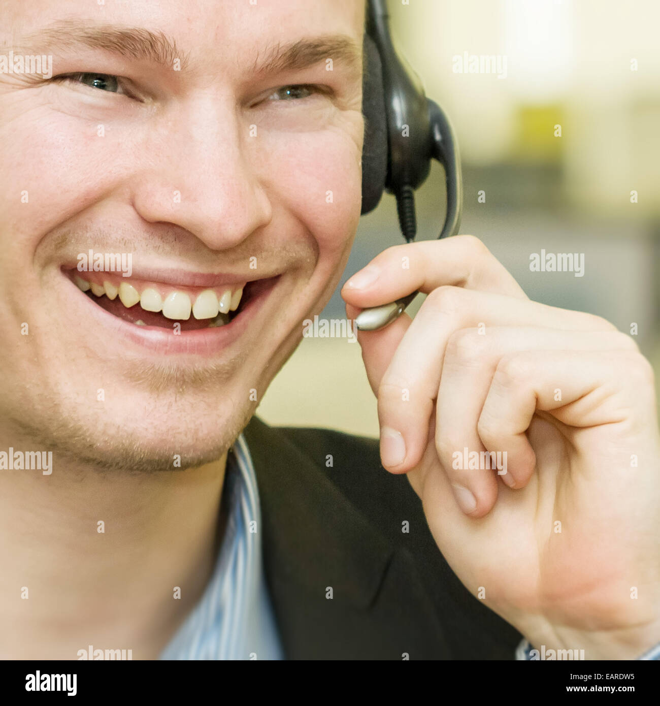 Call Centre staff - young blond man wearing an audio headset Stock ...