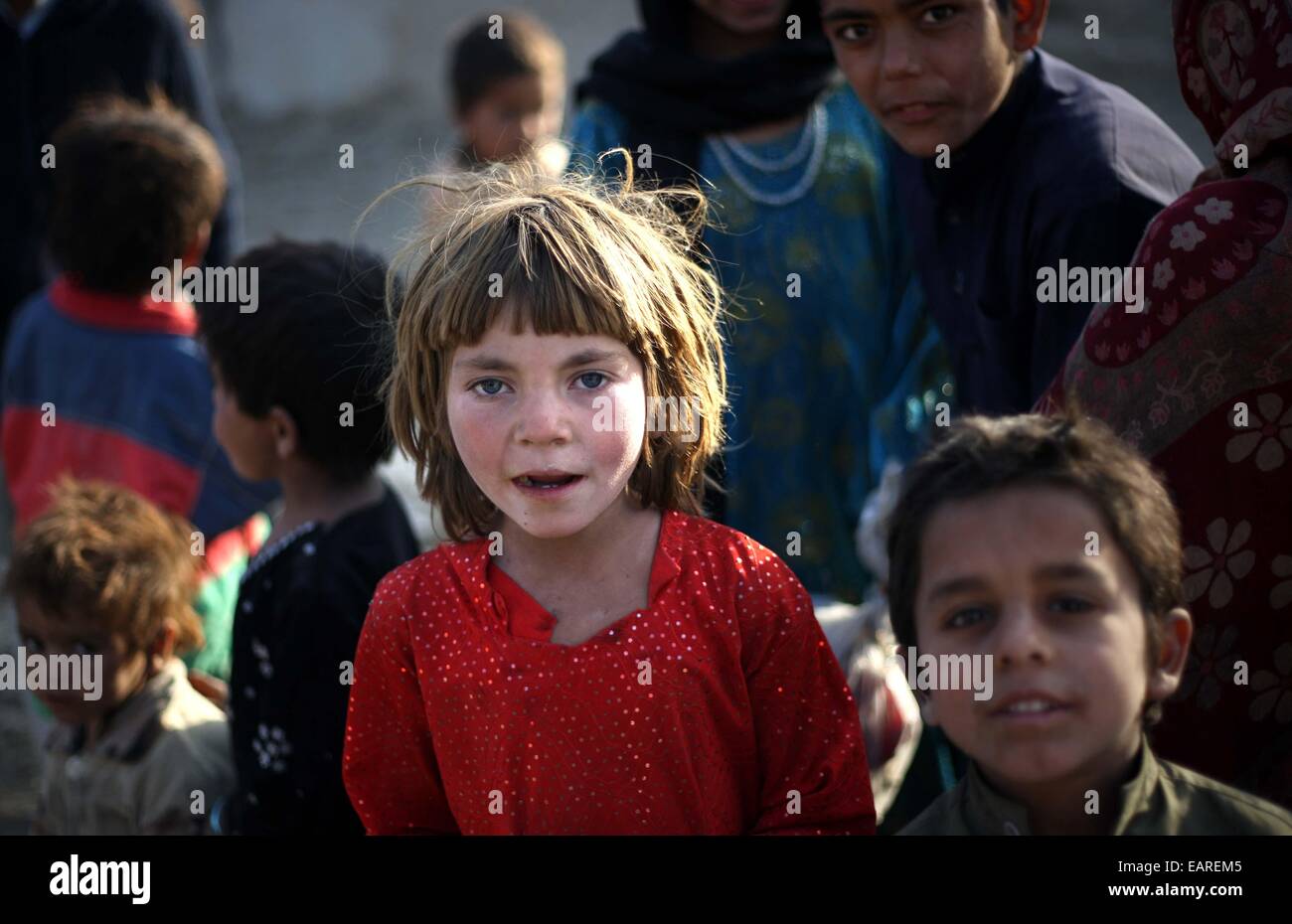 Kabul, Afghanistan. 19th Nov, 2014. Children gather outside their homes ...