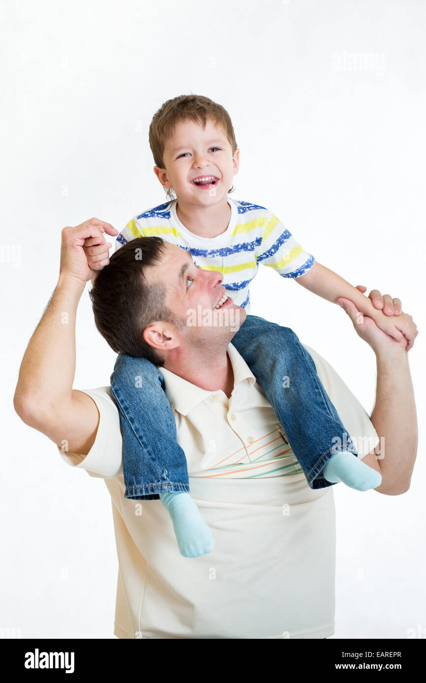 smiling kid boy riding dad's shoulders isolated Stock Photo - Alamy