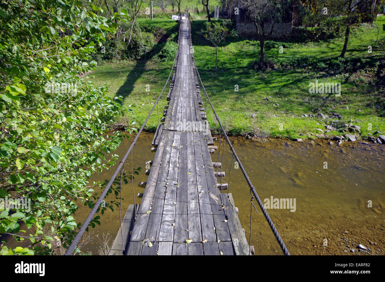 Small rope bridge over mountain river. Connection with the world Stock ...
