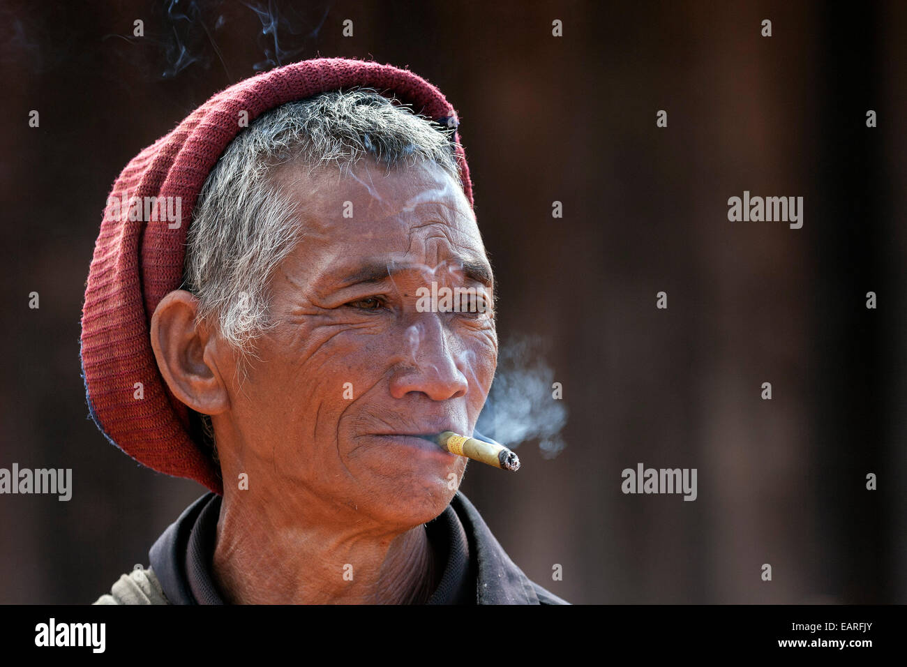 Man of the Akha ethnic group, with cigar, portrait, near Kyaing Tong ...