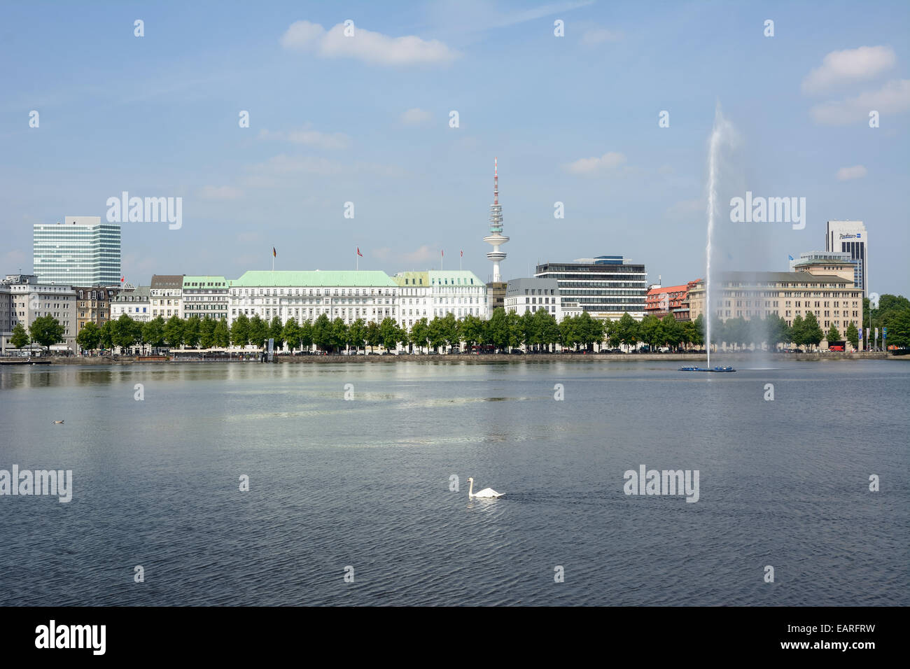View over the Inner Alster Lake with Alster Fountain and an Alster swan ...