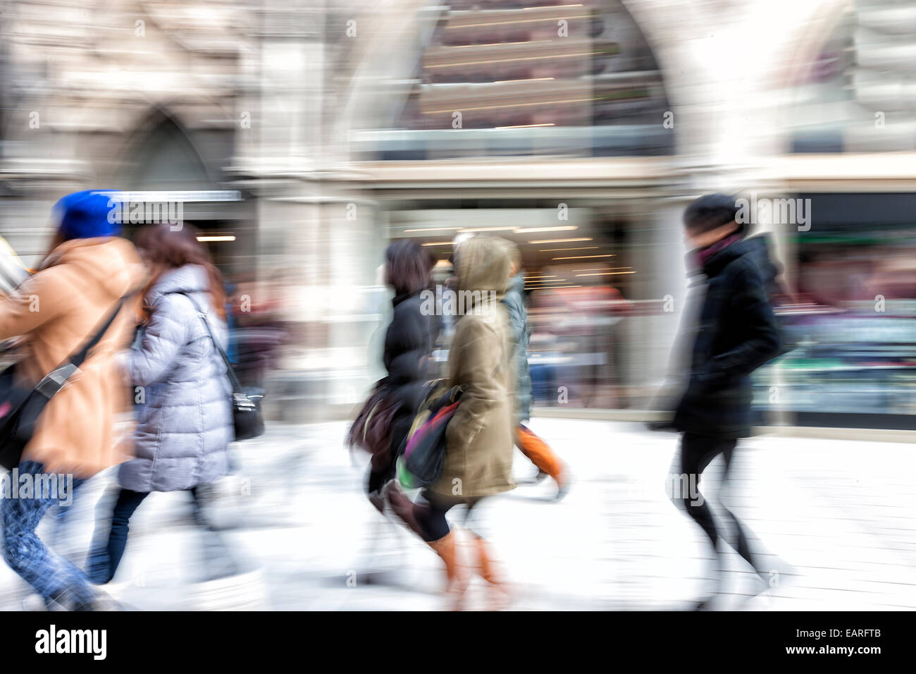Woman in rushing crowd hi-res stock photography and images - Alamy