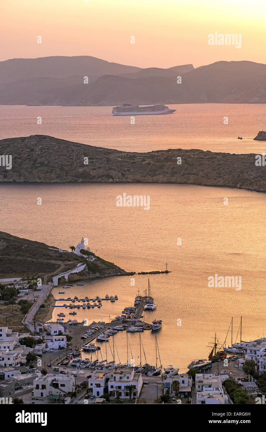 View from above at Ormos- the port of Ios island- during sunset ...