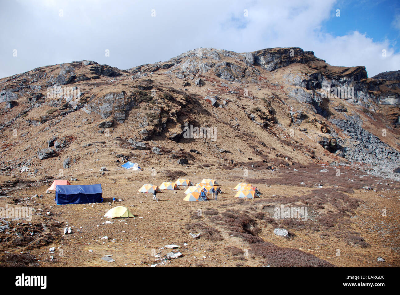 The tents of a trekkers camp at a high point in the Himalayas in the ...