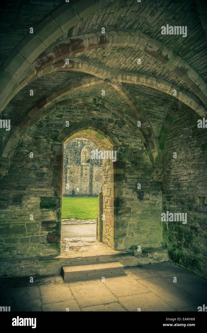 Abbey interior with a vaulted stone ceiling and arched doorway Stock ...
