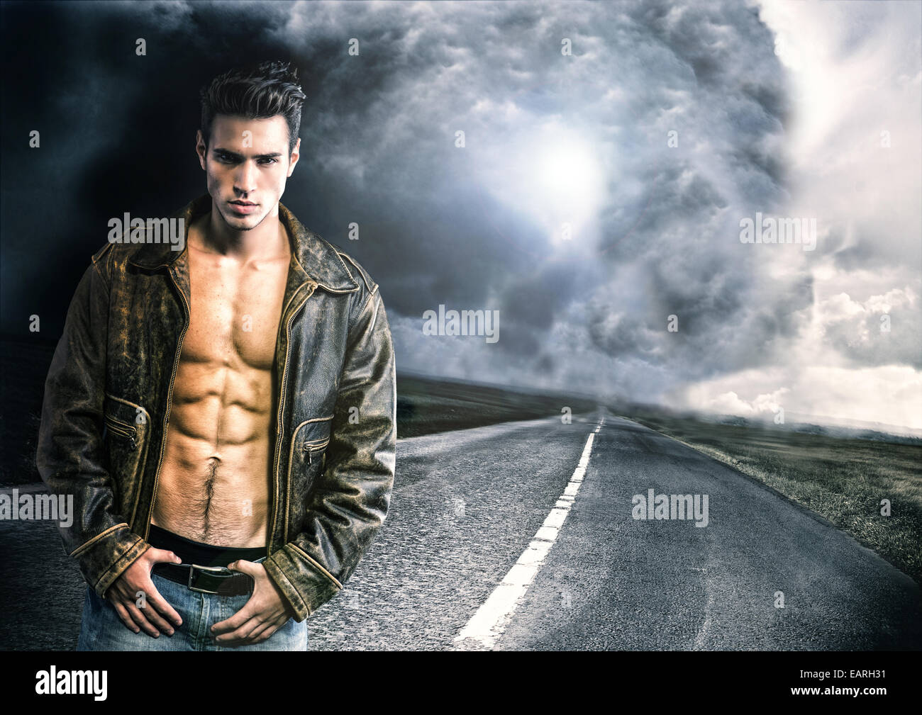Young man walking down a road with a storm and very bad weather far ...