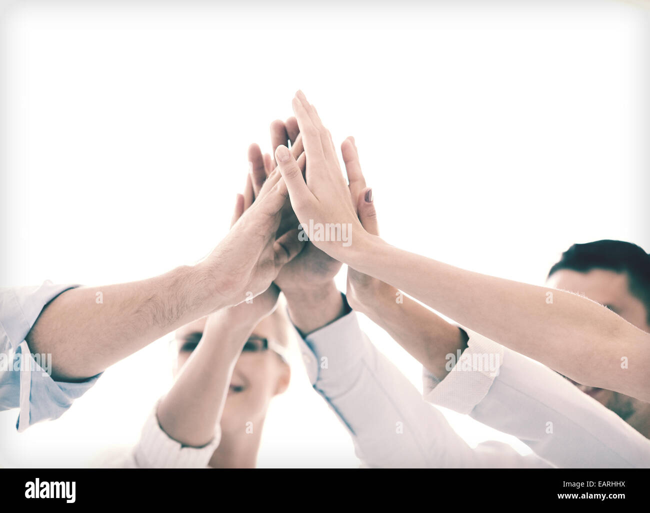 happy business team giving high five in office Stock Photo - Alamy