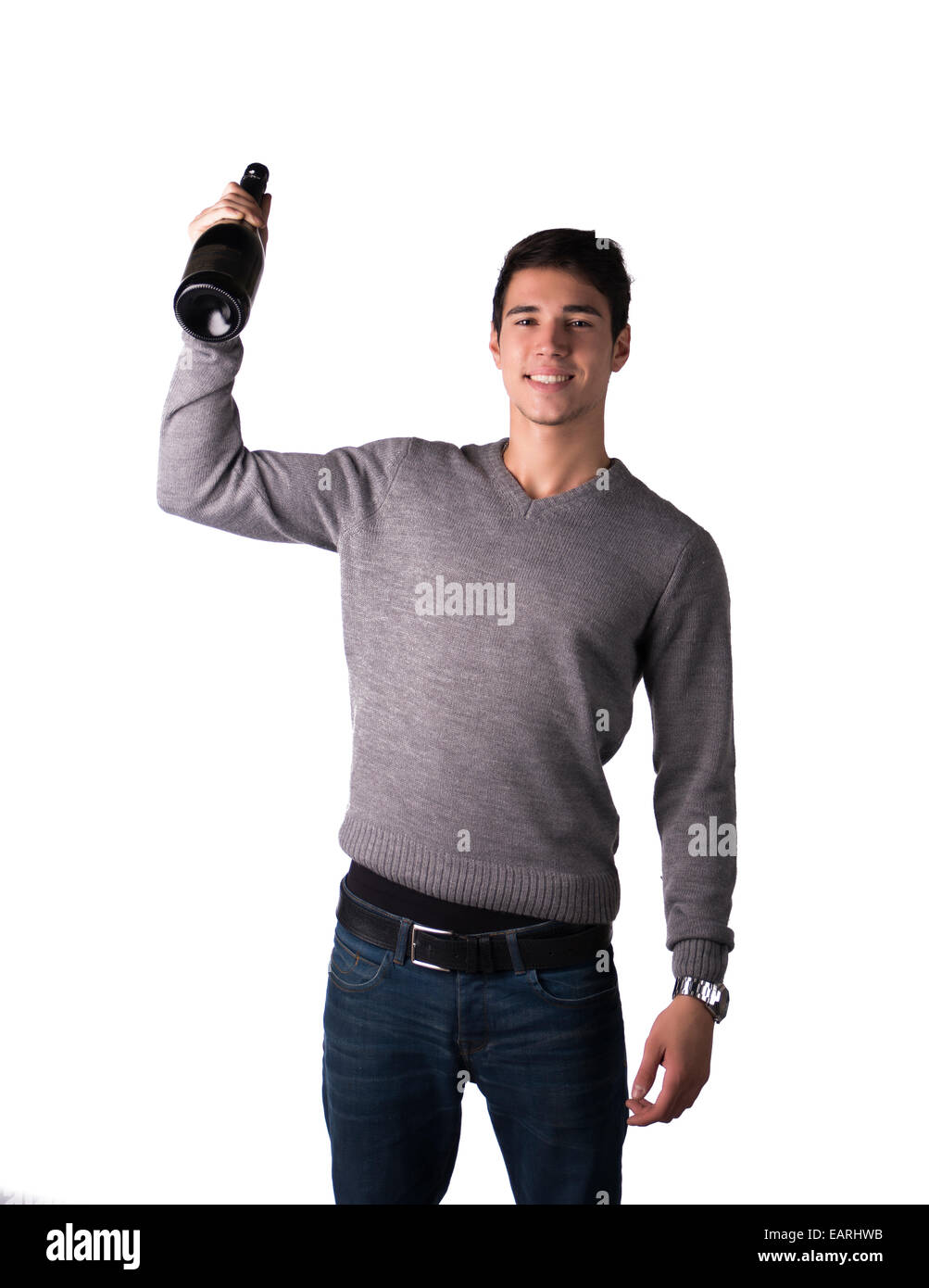 Handsome young man holding bottle of champagne or sparkling white wine ...