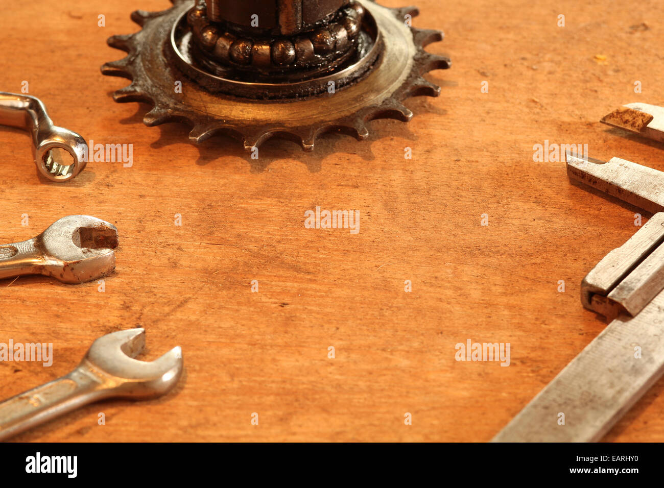 spanners and parts of the wooden table Stock Photo - Alamy