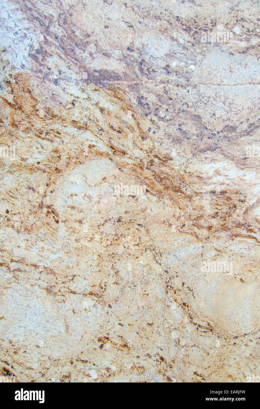 A full slab of cut and polished Granite makes a background of textures ...