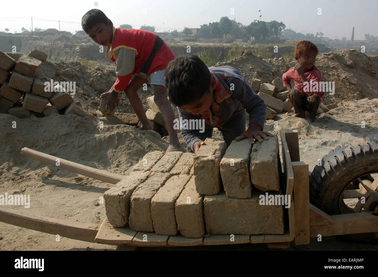 Lahore, Pakistan. 20th November, 2014. Pakistani boys arrange bricks at ...