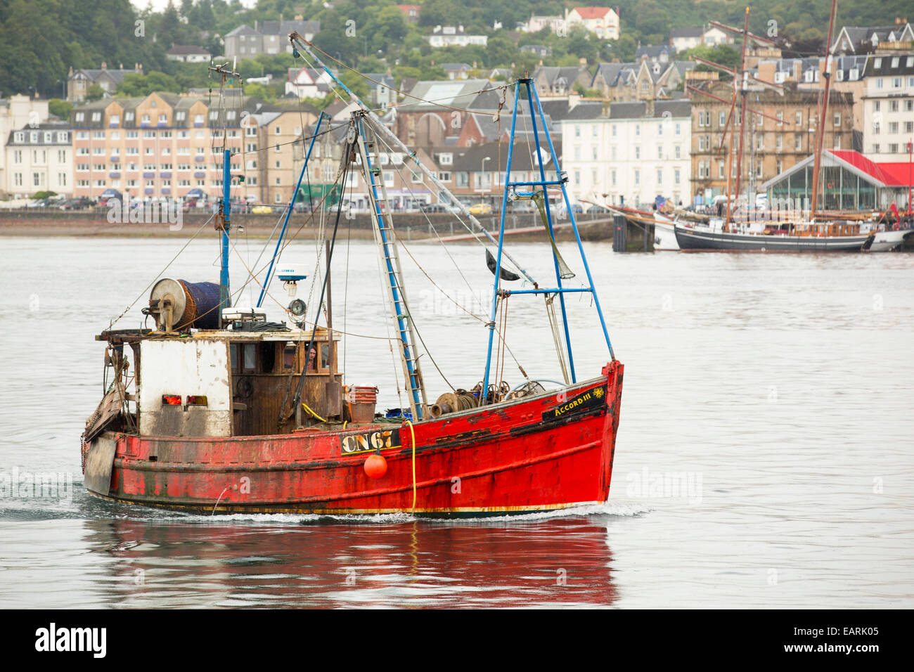 A fishing boat heading back to port in Oban, scotland, UK Stock Photo ...
