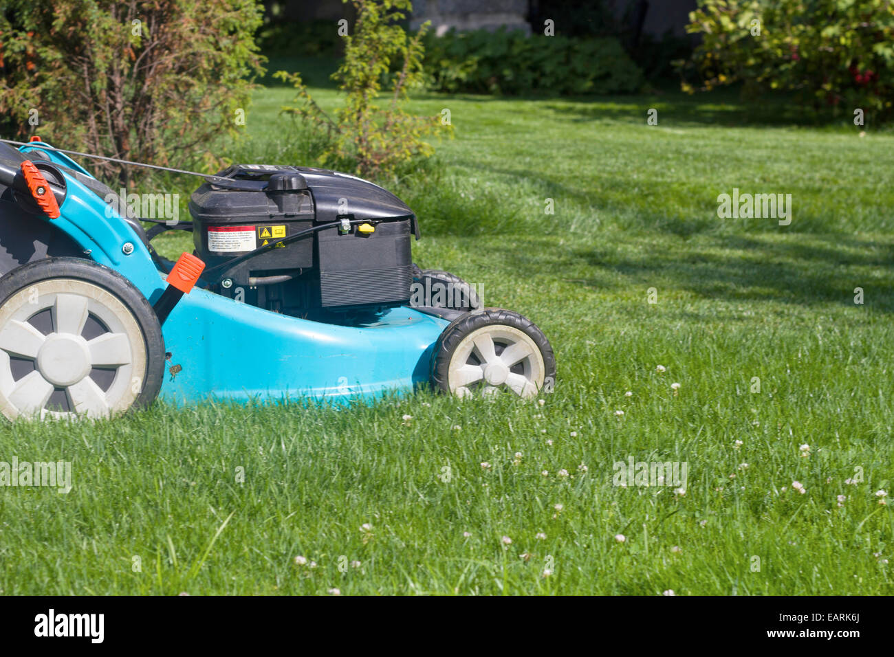 mower on the mown grass in the yard Stock Photo - Alamy