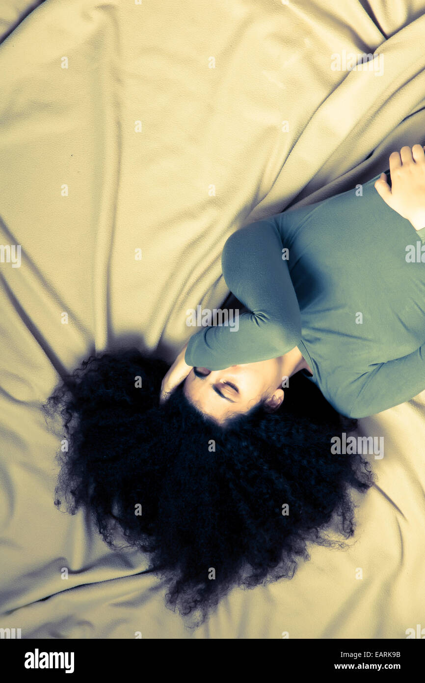 A brazilian woman having a bad night with nightmares Stock Photo - Alamy