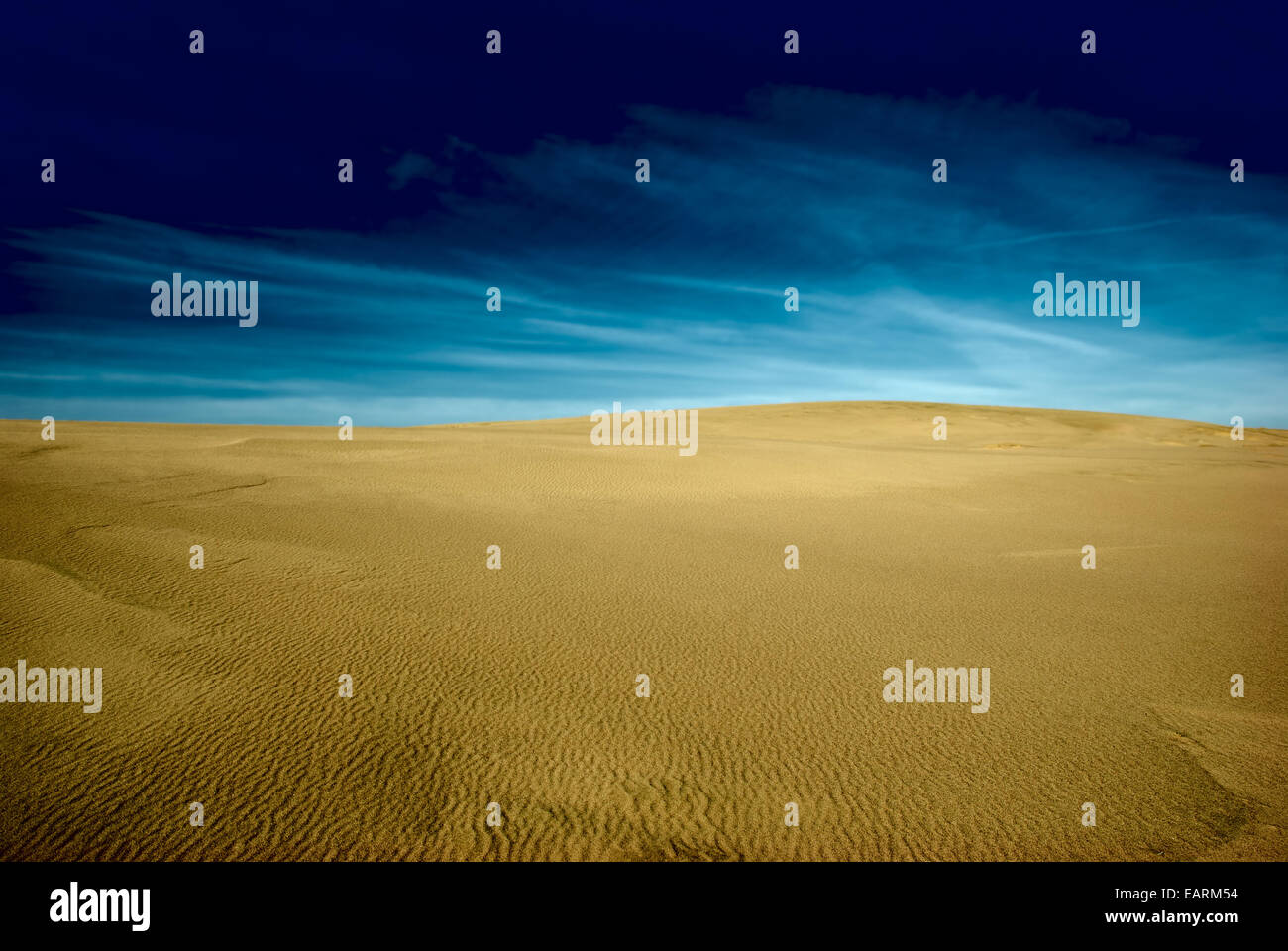 Background of sandy landscape and dark sky Stock Photo - Alamy