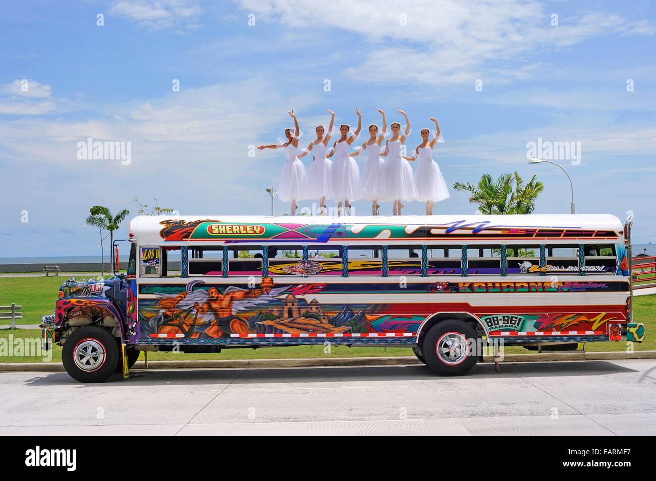 A ballerina balancing on top of a classical 'Red Devil' bus Stock Photo ...
