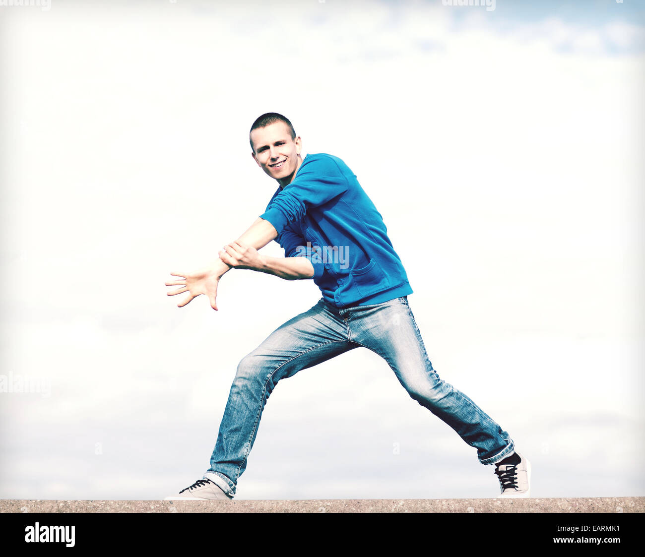 handsome boy making dance move Stock Photo - Alamy