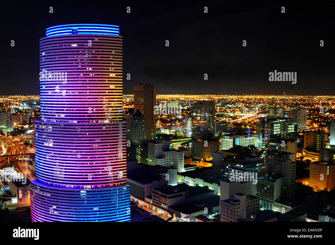 View of the Miami skyline at night with city lights and light trails ...