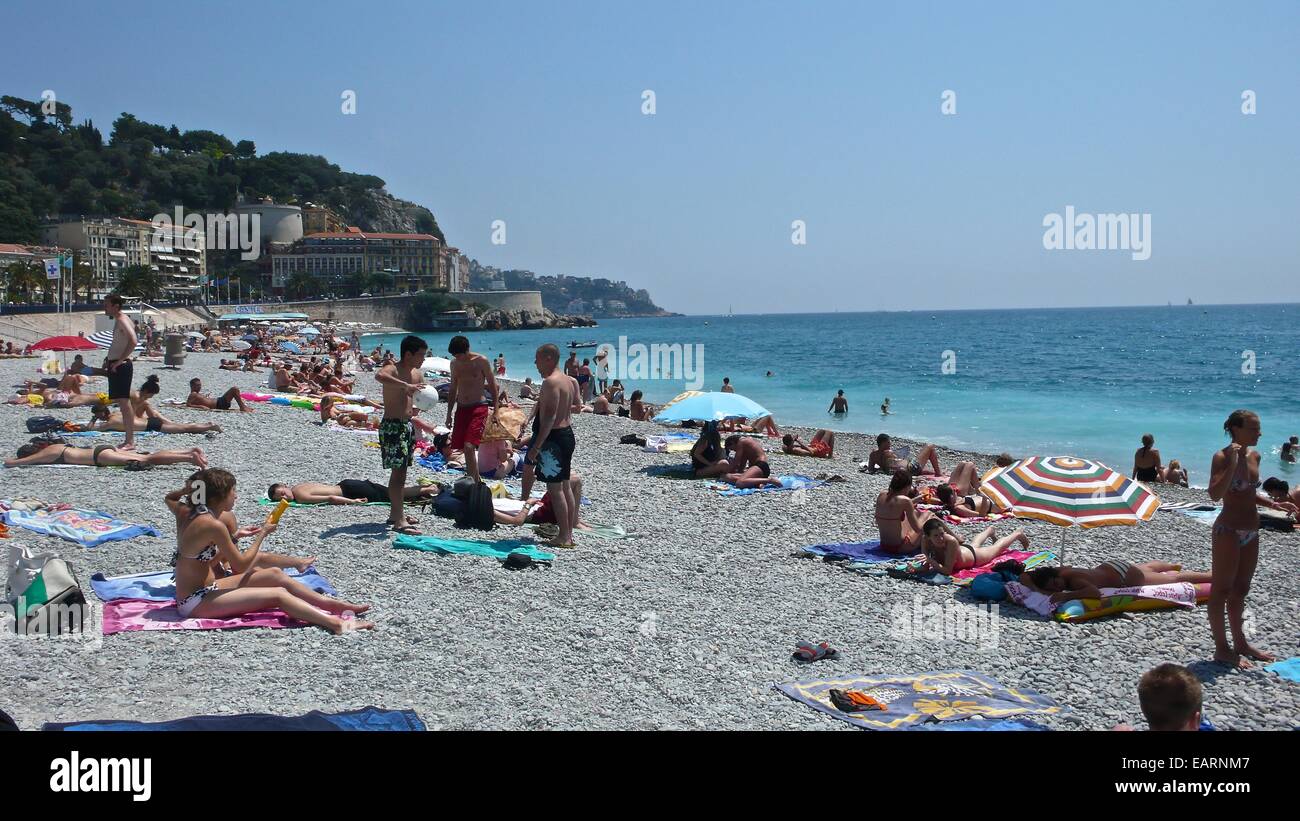 Sunbathers populate the shoreline of the French Riviera Stock Photo - Alamy