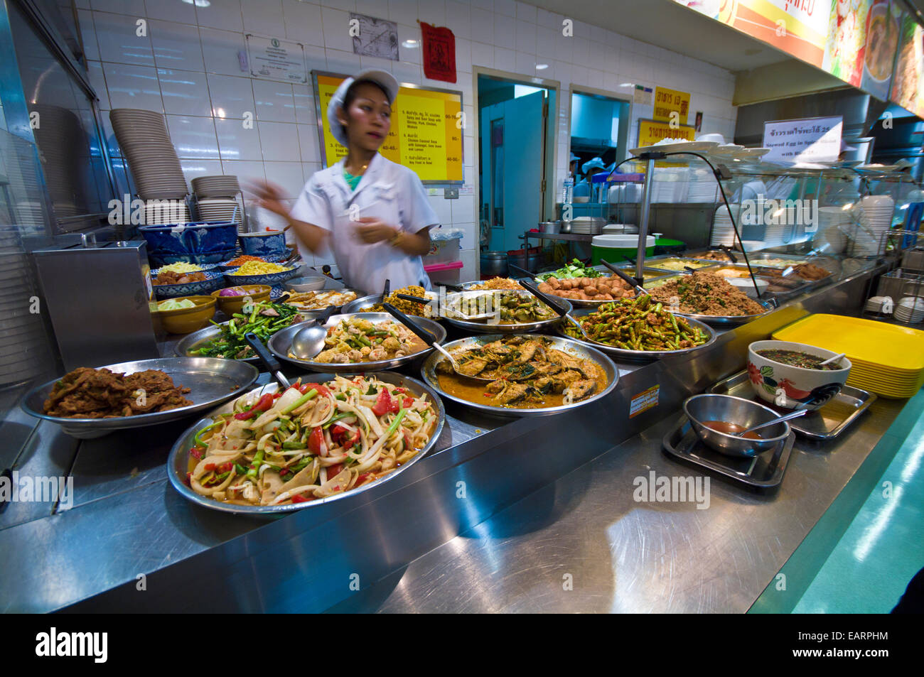 Take-away spicy noodle and curry dishes for sale in a mall food court ...