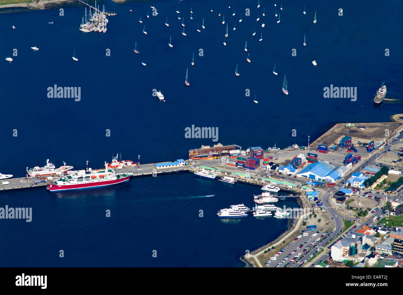 Container ships, yachts and tourist ships in a sheltered city harbor ...