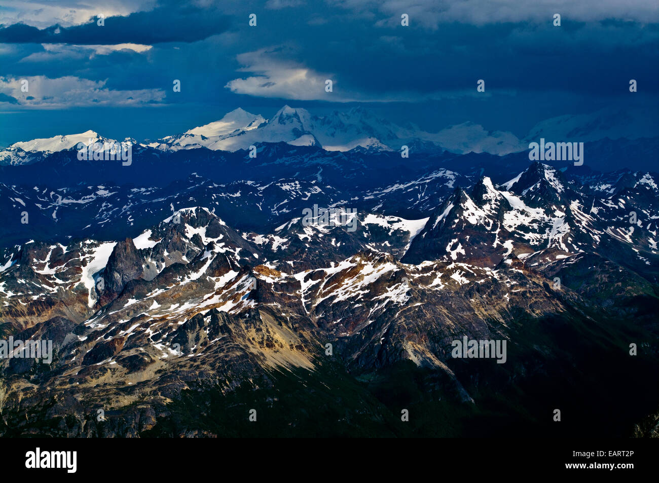 A winter storm engulfs the spine of the Andes covered in snow and ice ...