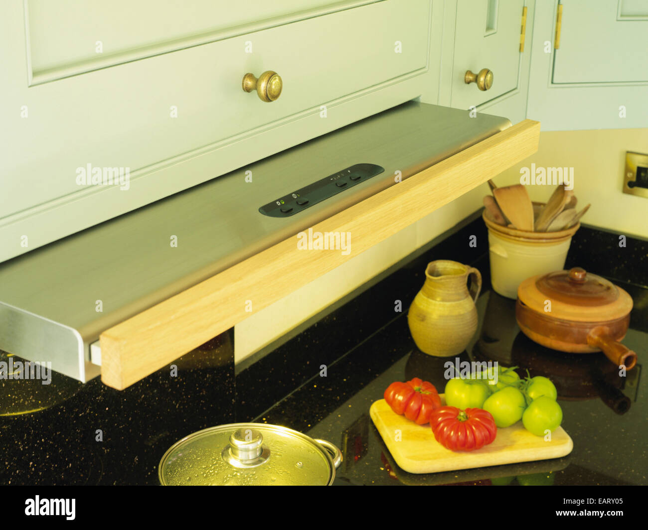 Pull out extractor fan above kitchen worktop Stock Photo - Alamy