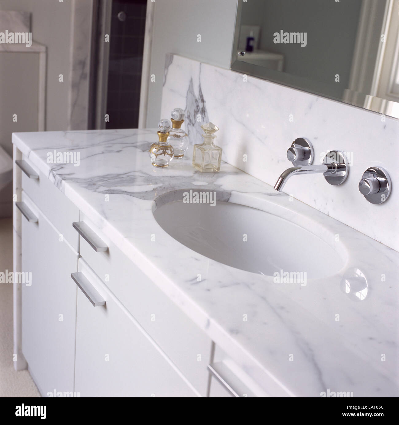 Washbasin set in marble top on cupboard unit Stock Photo - Alamy