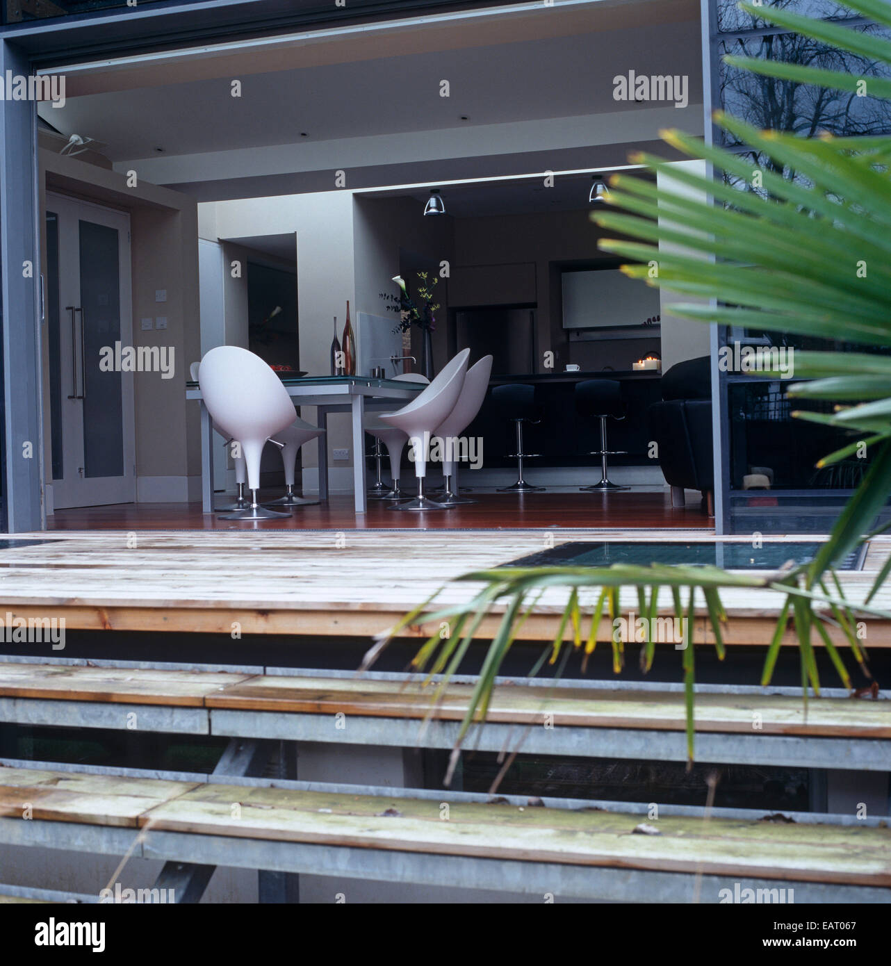 View from outside into contemporary room with table and chairs Stock ...
