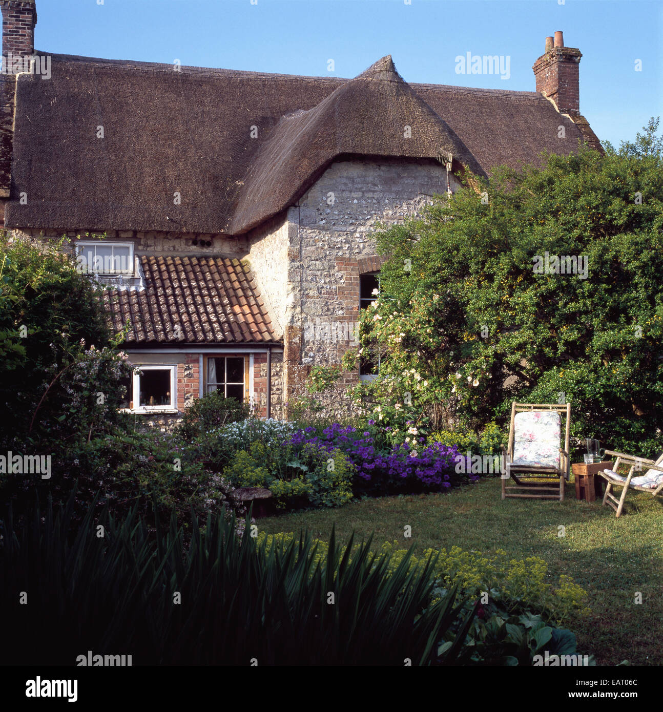 The exterior of the back garden of a traditional country house with ...