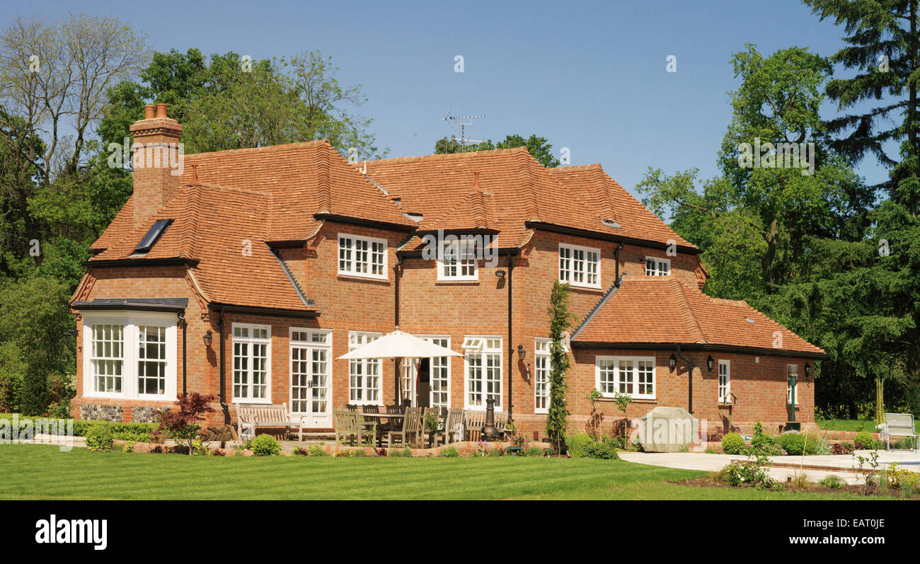 Exterior of detached country style house and garden Stock Photo - Alamy