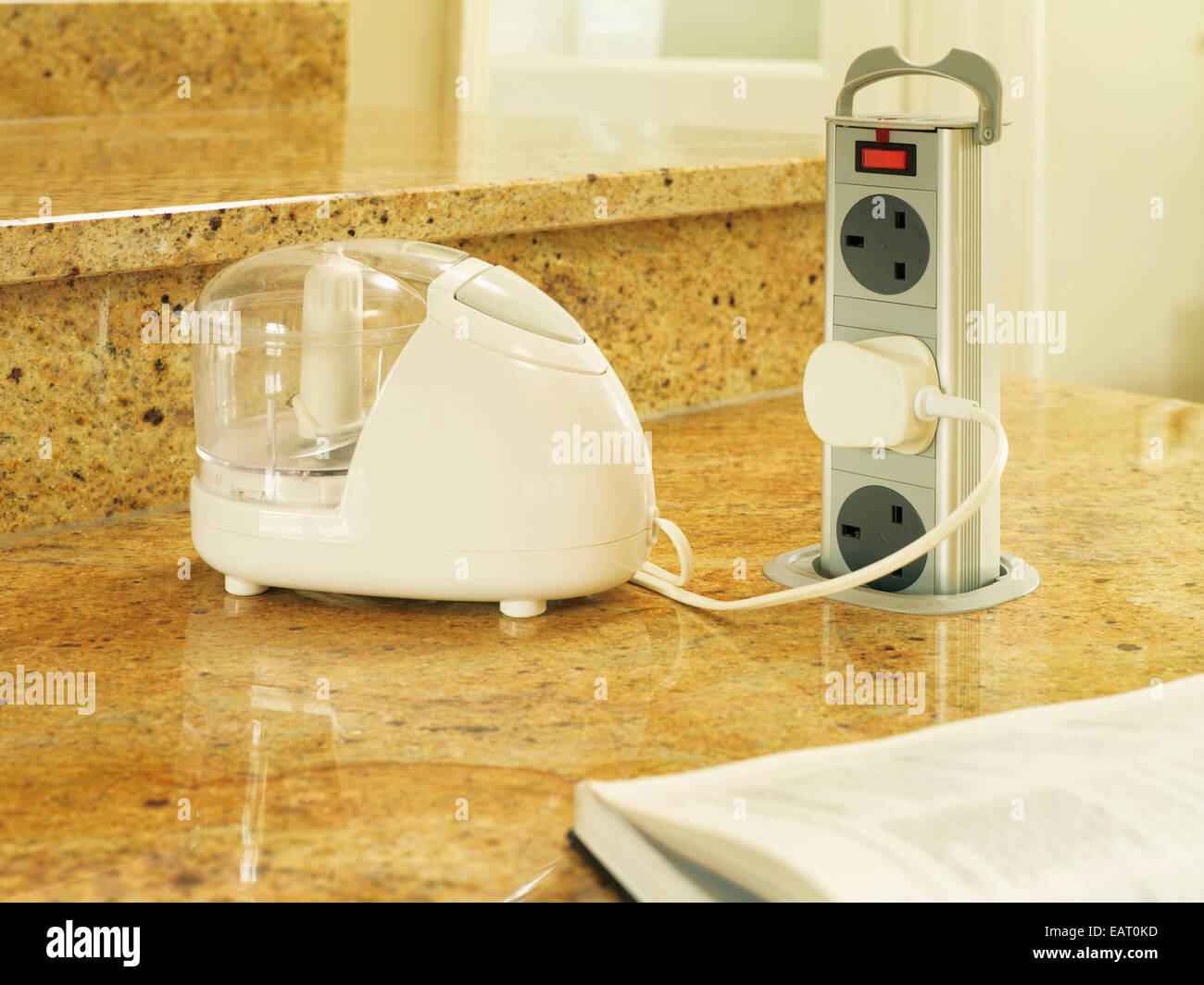 Food processor plugged into pop up electrical socket Stock Photo - Alamy